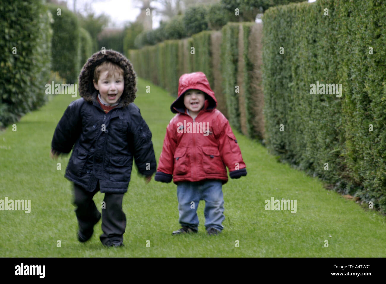 Boys playing rain laughing hi-res stock photography and images - Alamy