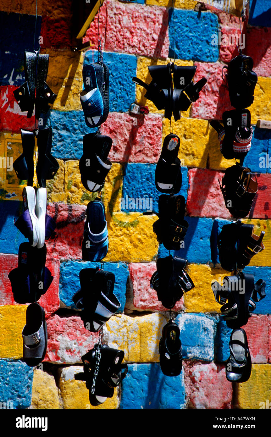 Shoes hanging up outside a shoe shop in Karak Jordan Stock Photo - Alamy