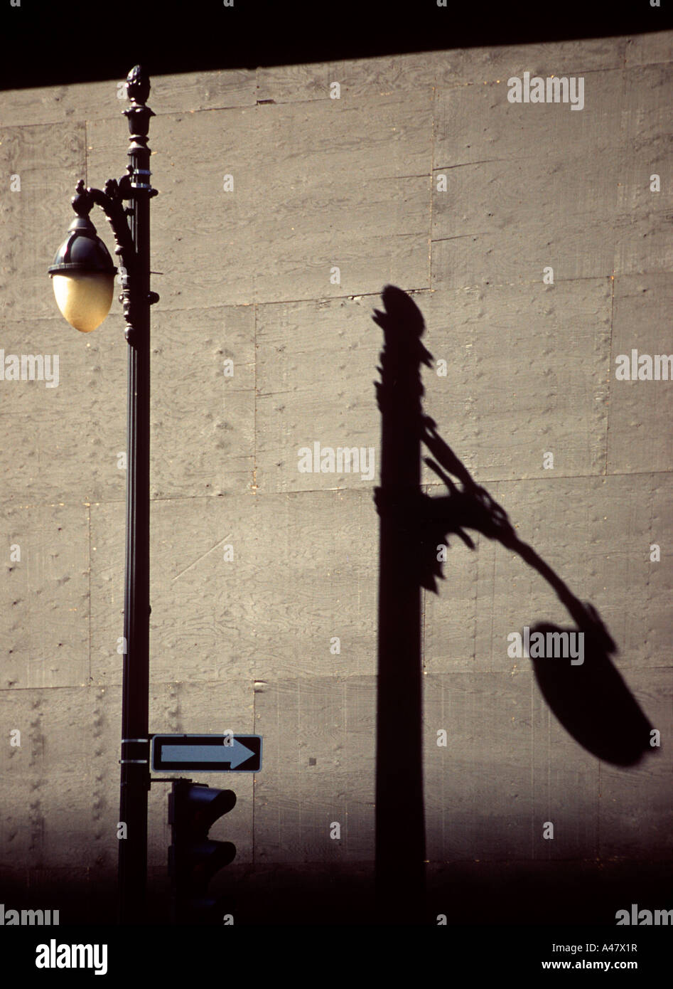 A street lamp casts its shadow on a wall Stock Photo - Alamy