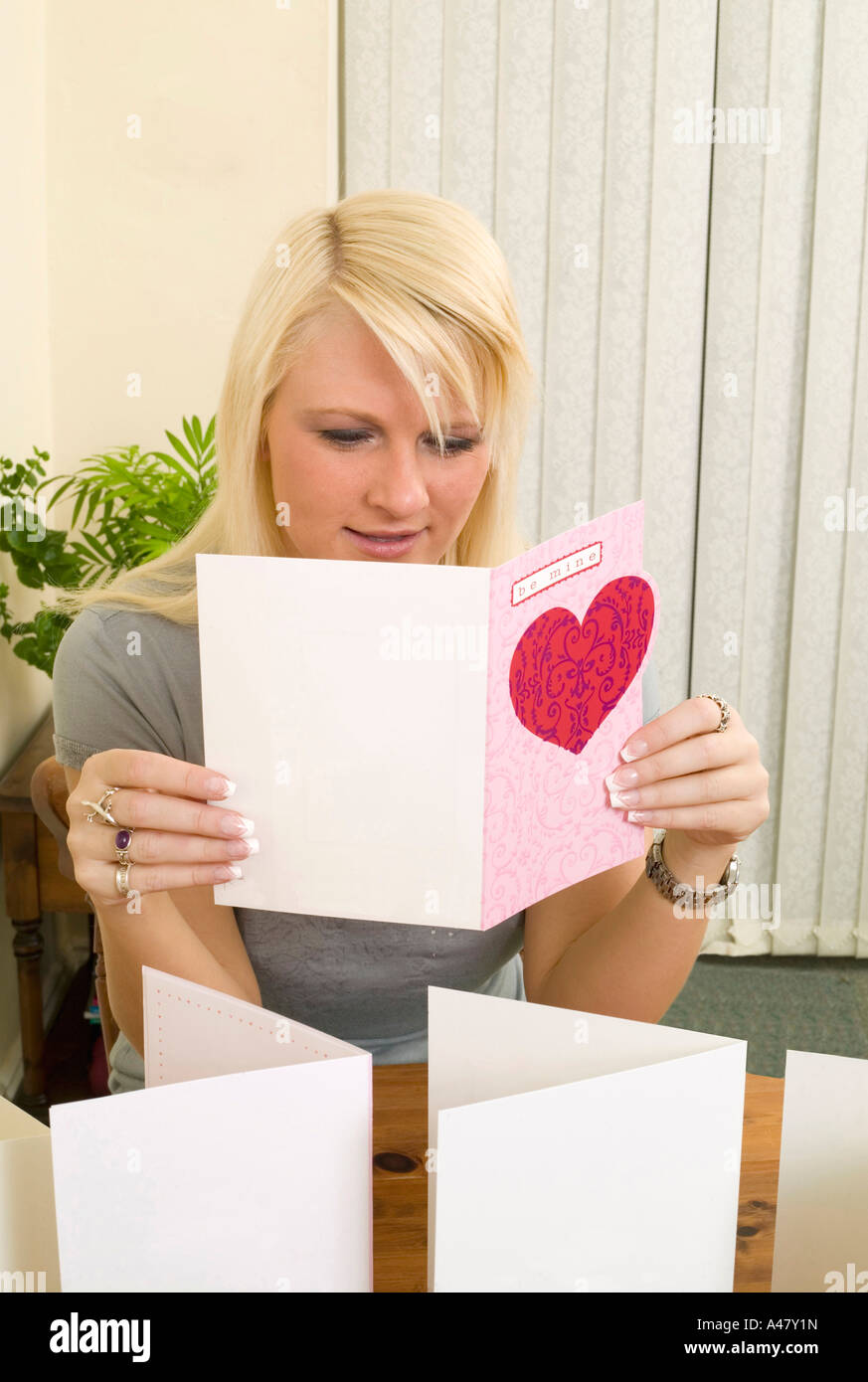 woman reading valentines cards Stock Photo - Alamy