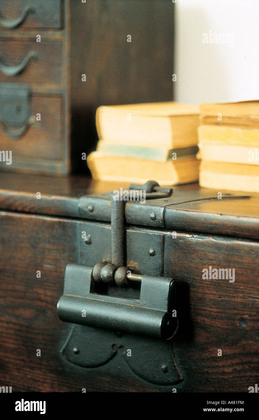 Close-up of books on a locked wooden chest Stock Photo - Alamy