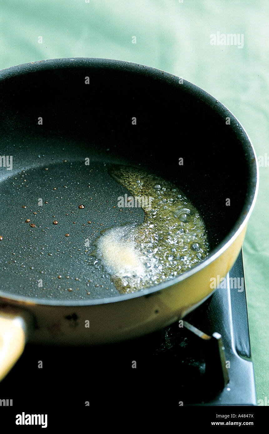 High angle view of butter melting in a frying pan Stock Photo - Alamy