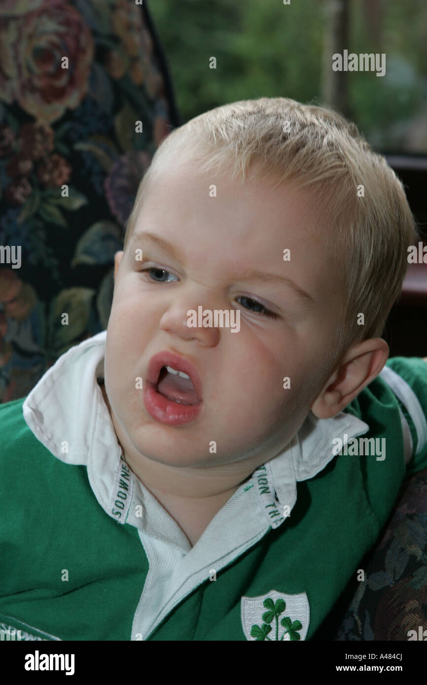 Toddler pulling a face Stock Photo - Alamy