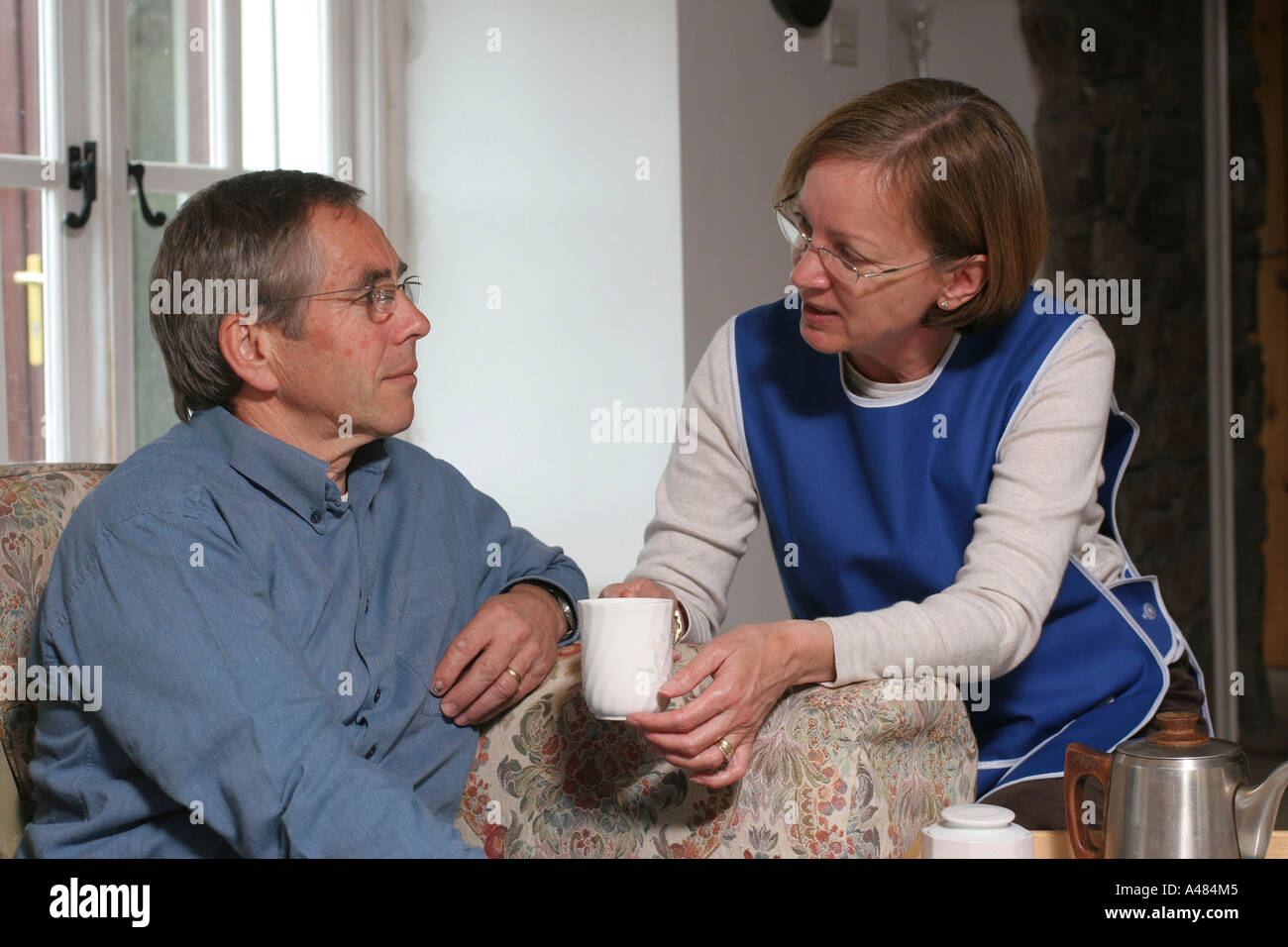 Old lady looking after husband hi-res stock photography and images - Alamy