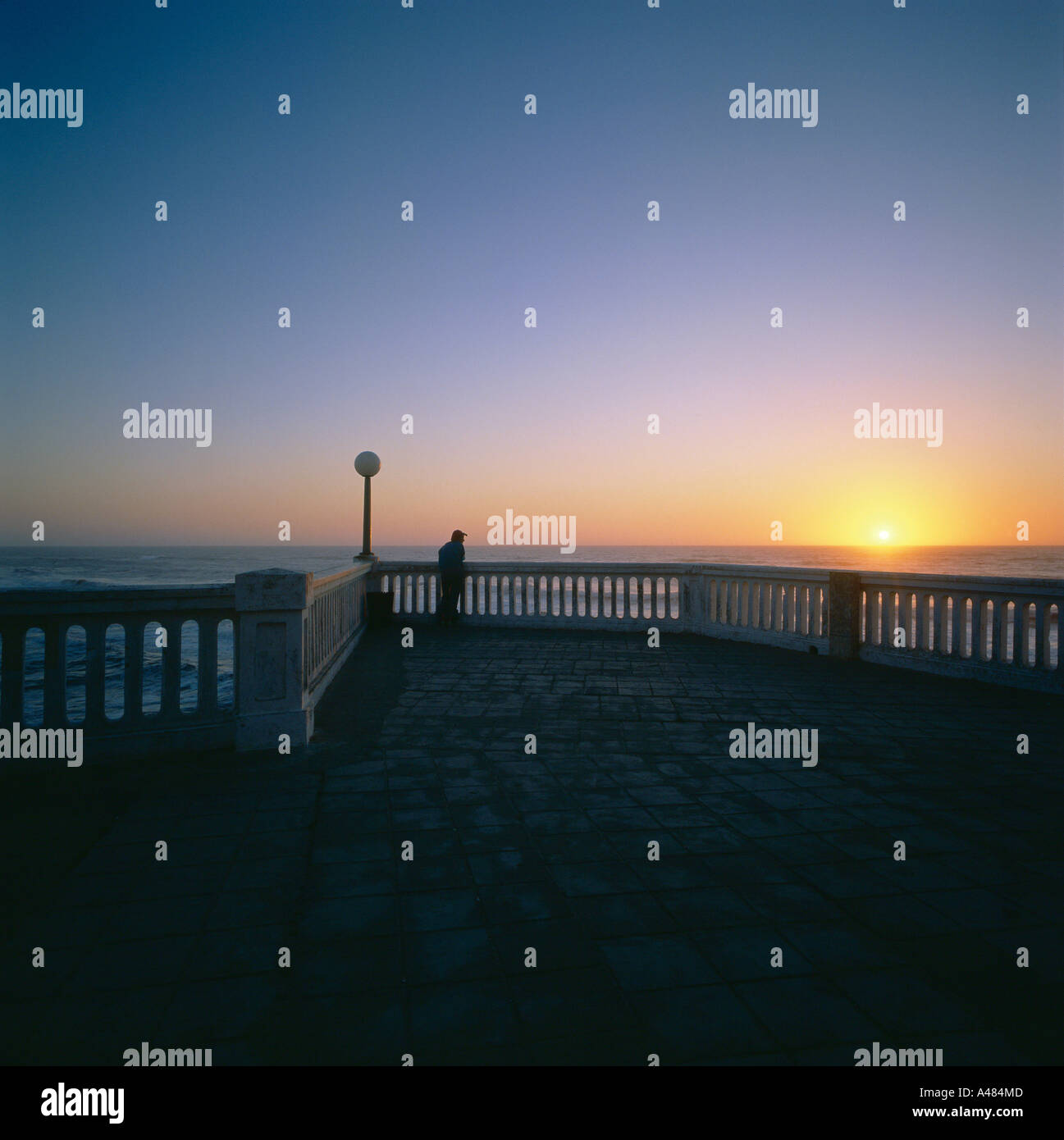 Beach promenade at sunset Stock Photo - Alamy