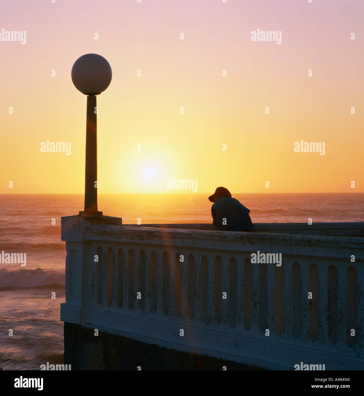 Beach promenade at sunset Stock Photo - Alamy