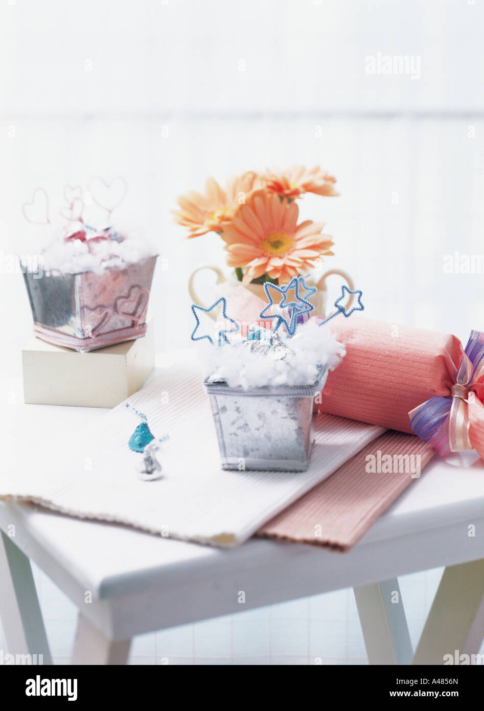 Flowers with birthday presents on the table Stock Photo - Alamy