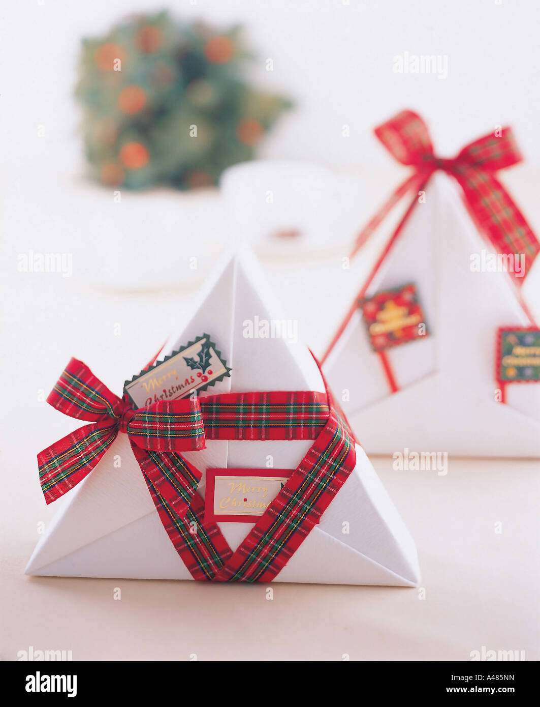 Two triangular shaped gift boxes hi-res stock photography and images ...