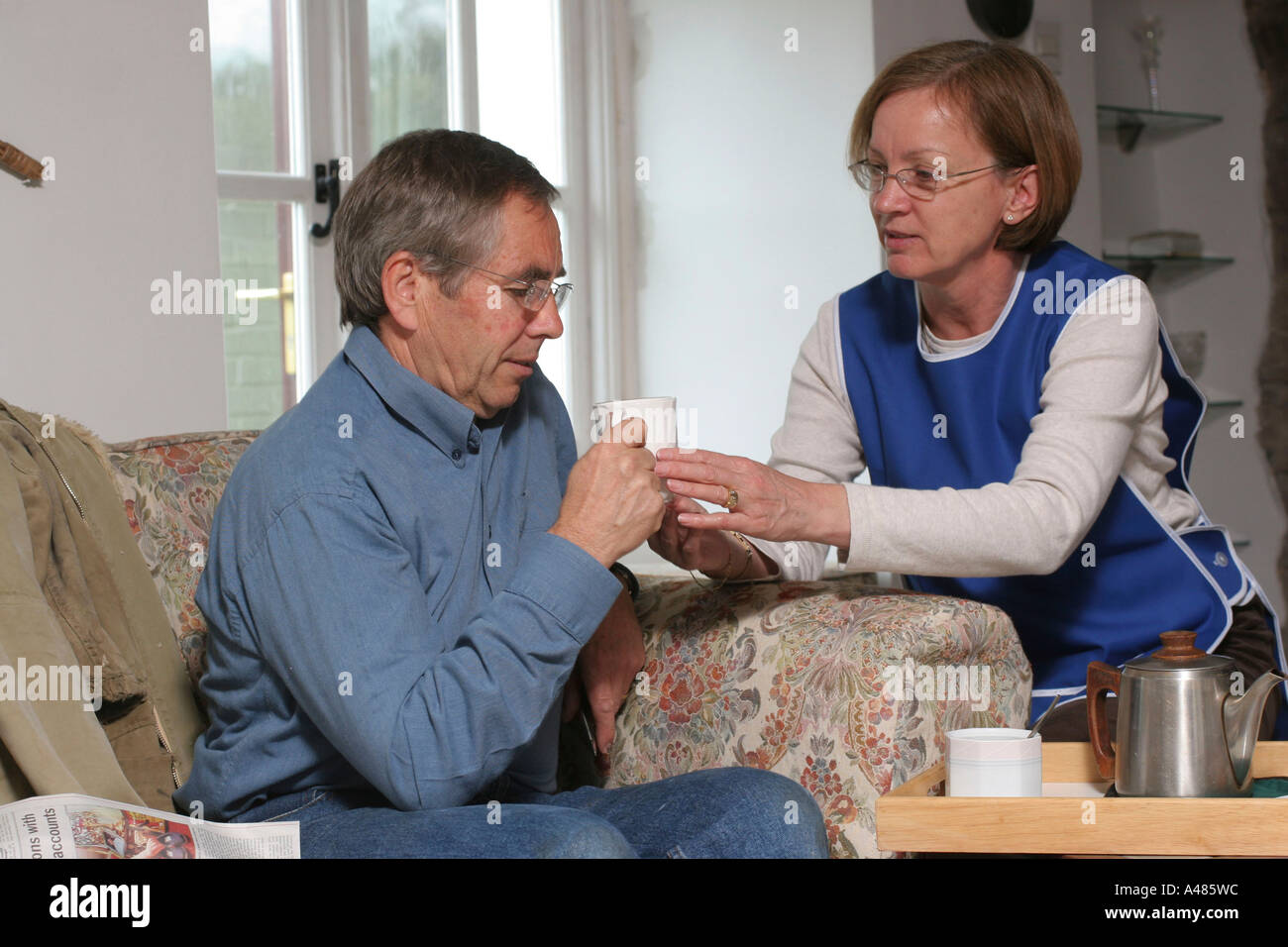 Carer looking after elderly ill hi-res stock photography and images - Alamy