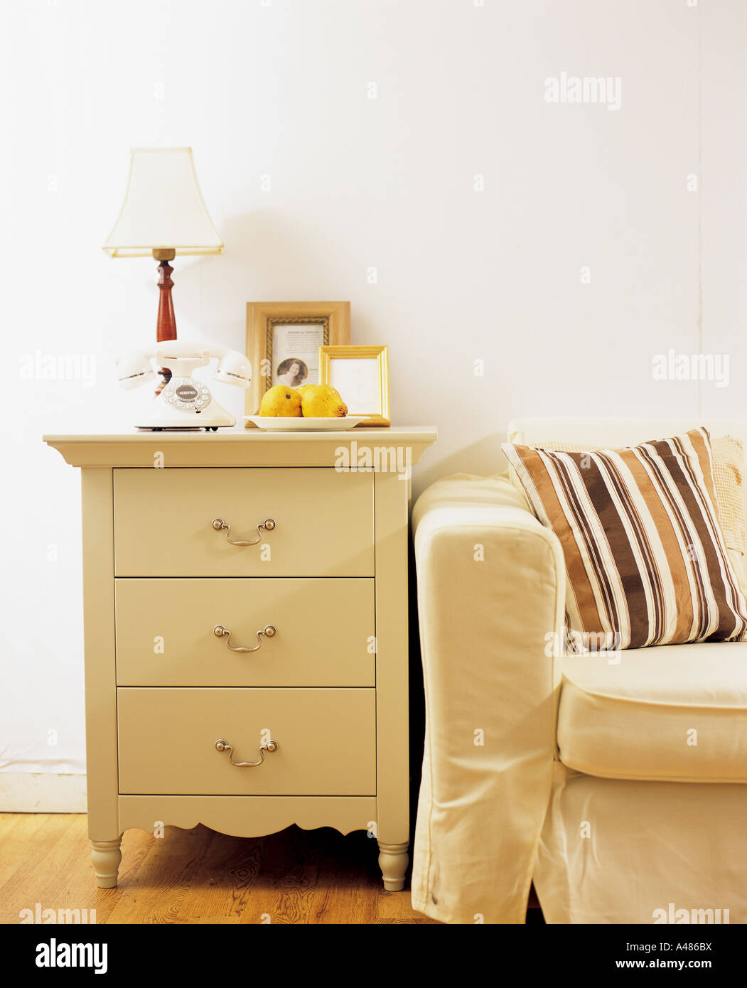 Telephone on the table near a couch Stock Photo - Alamy