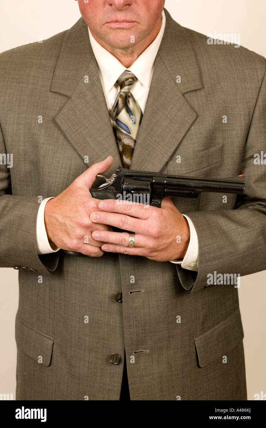 Mature man holding gun Stock Photo - Alamy
