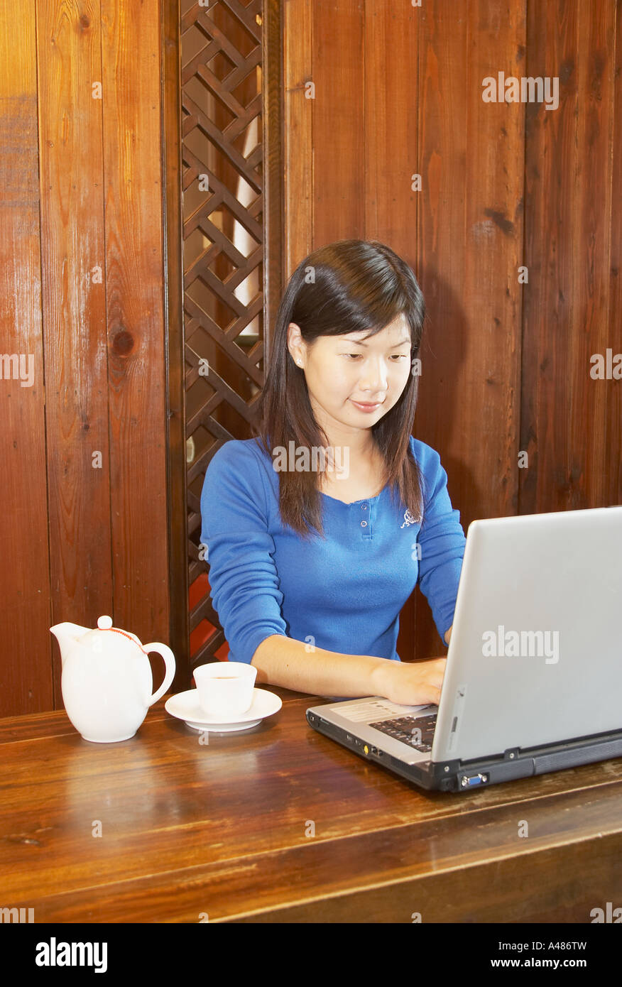 Woman Typing On Laptop, Taiwan Stock Photo - Alamy