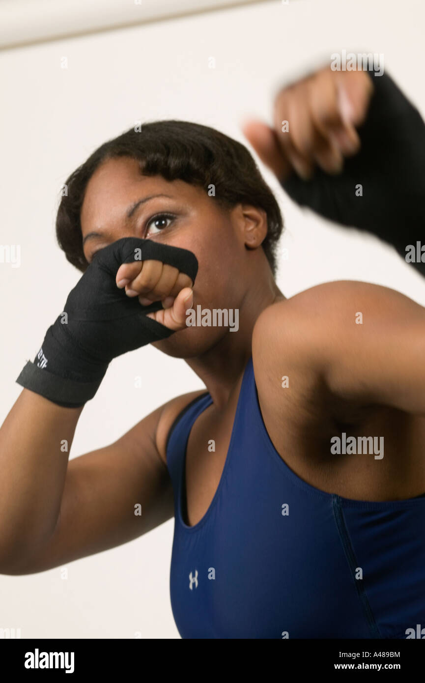 Mid adult woman practicing boxing Stock Photo - Alamy