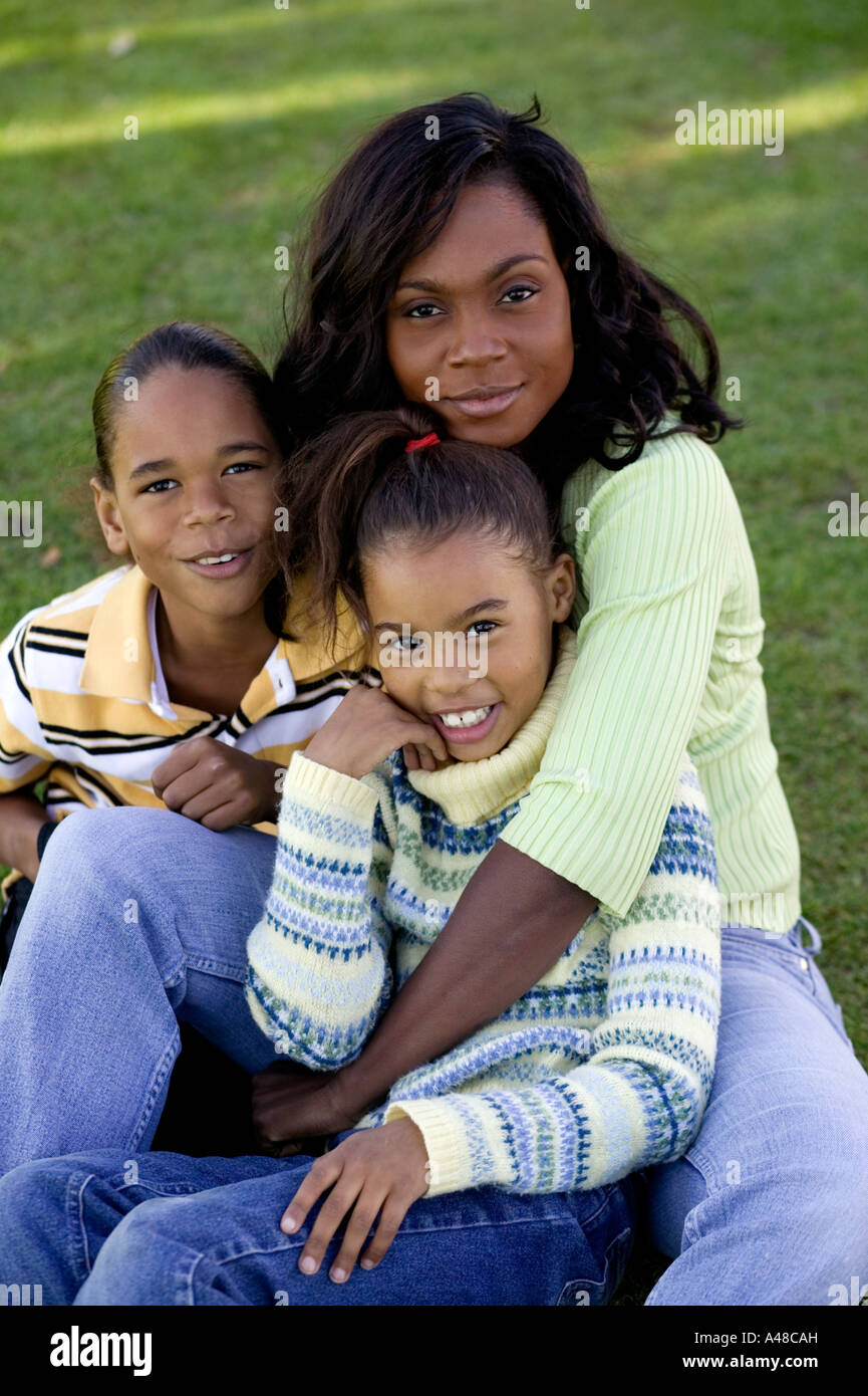 Woman with children smiling, portrait Stock Photo - Alamy