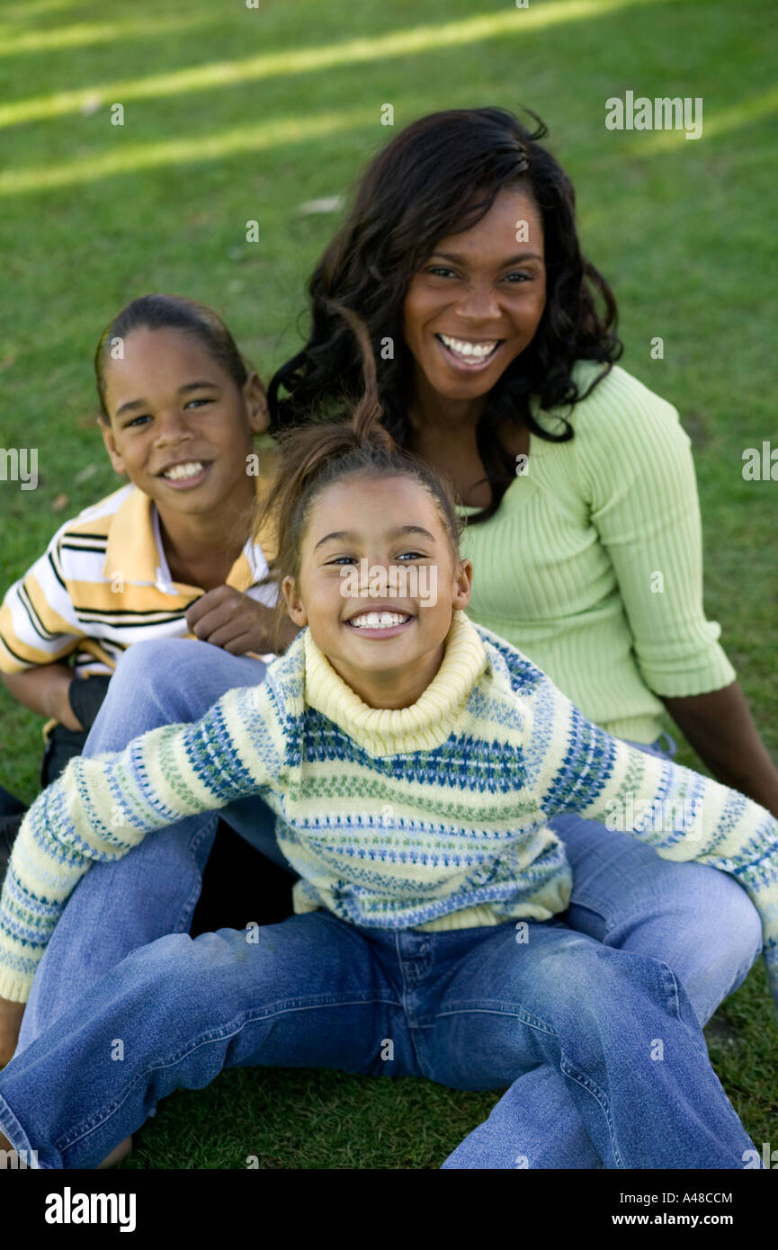 Woman with children smiling, portrait Stock Photo - Alamy