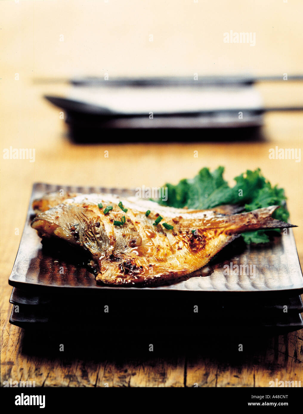 Close-up of roast fish Stock Photo - Alamy