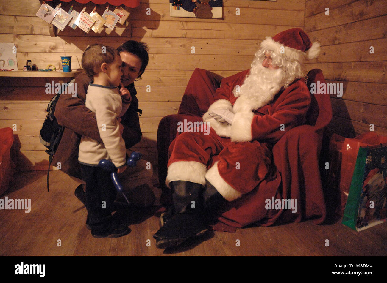 Young boy meeting Father Christmas Folly Farm Pembrokeshire Wales UK ...