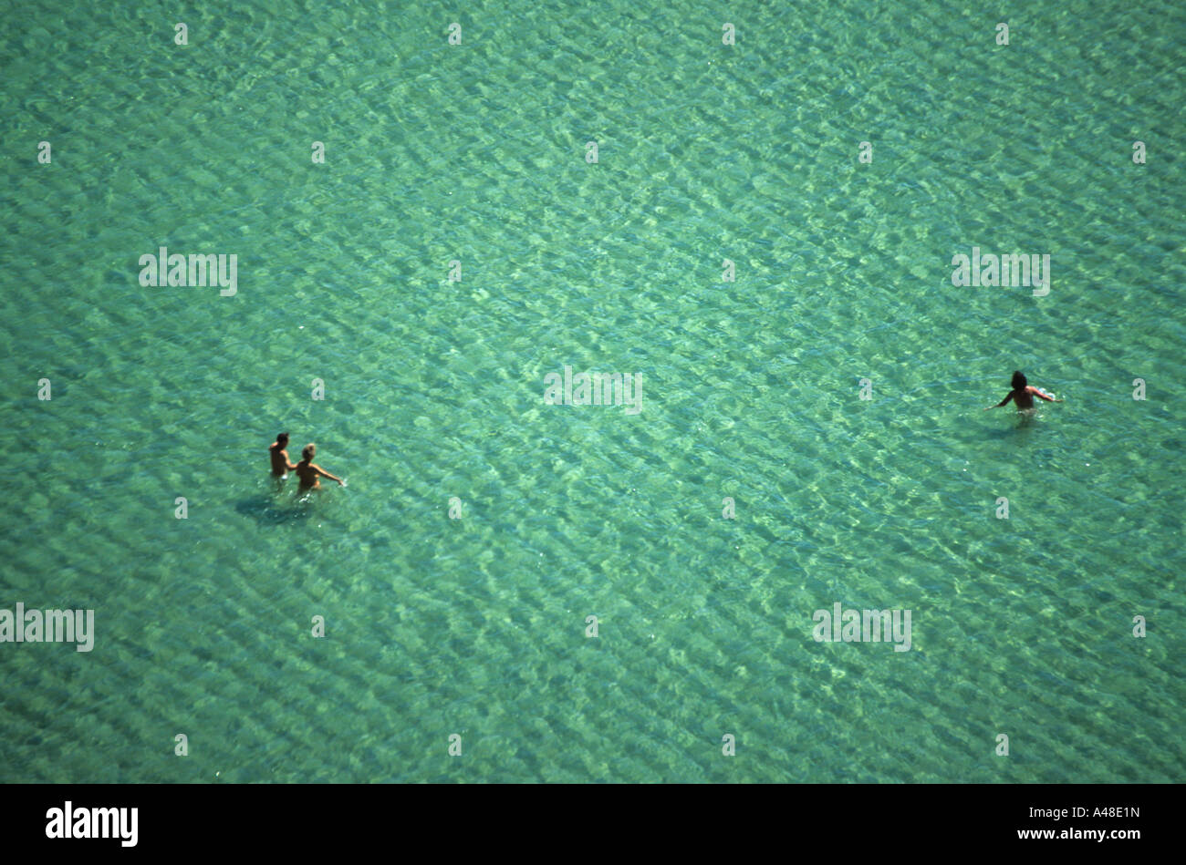 People wading in lagoon Porthcurno Cornwall England UK Europe Stock ...
