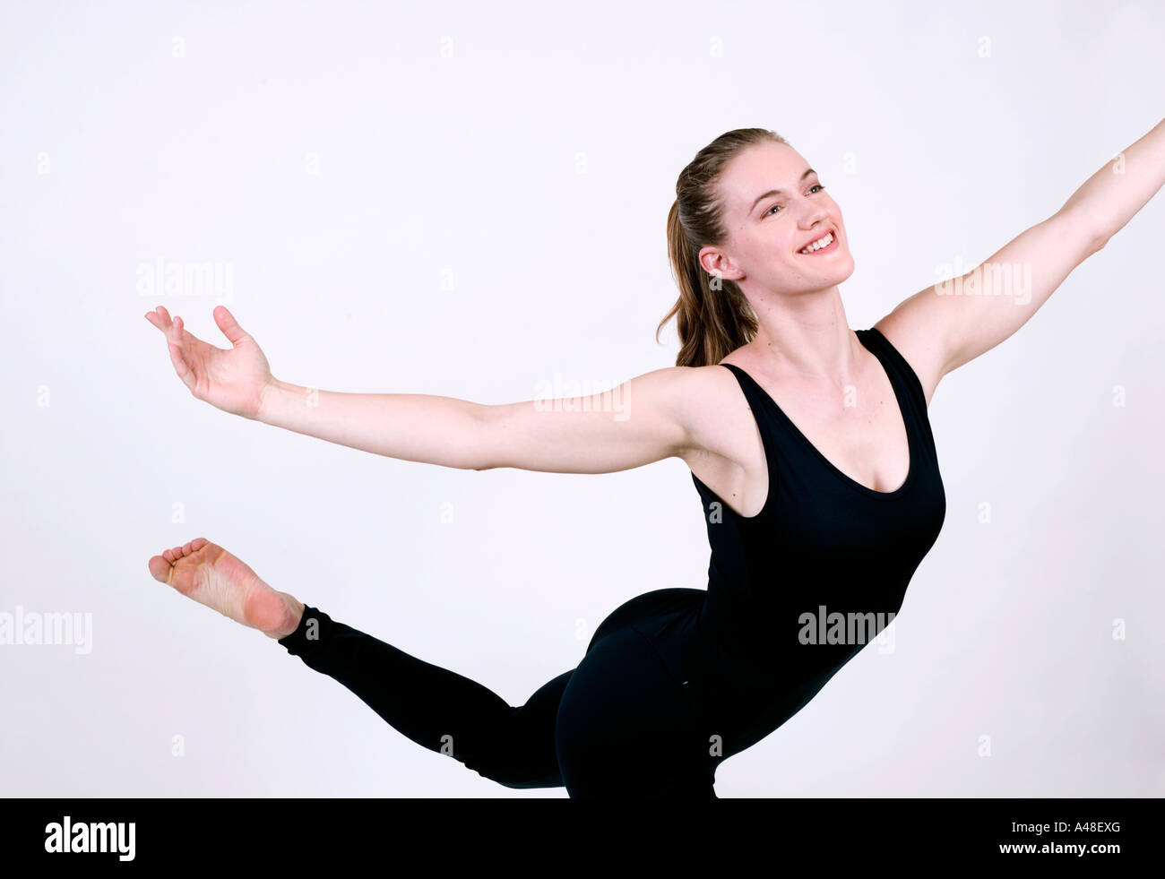 Young woman performing gymnastics Stock Photo - Alamy