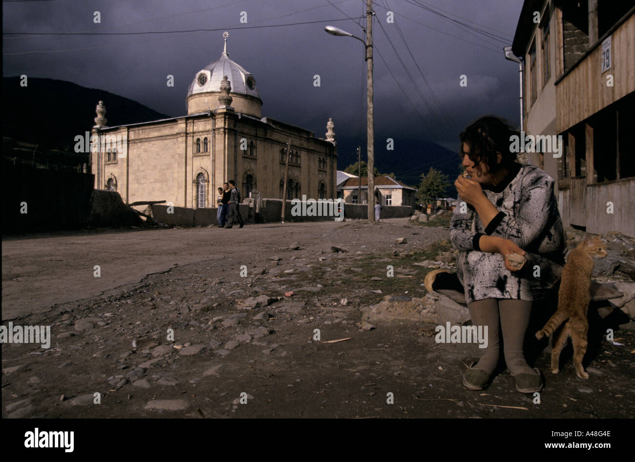 Jewish woman sitting near the synagogue in Oni Georgia CIS Stock Photo ...
