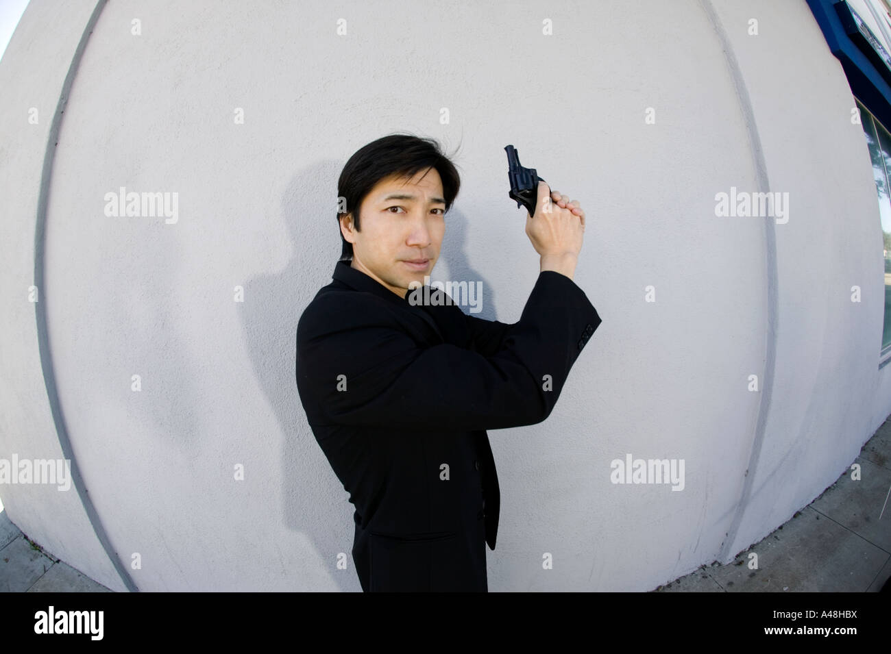 Mature man holding gun, portrait Stock Photo - Alamy