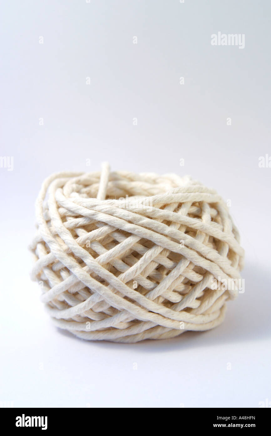 Ball of string against a white background Stock Photo - Alamy
