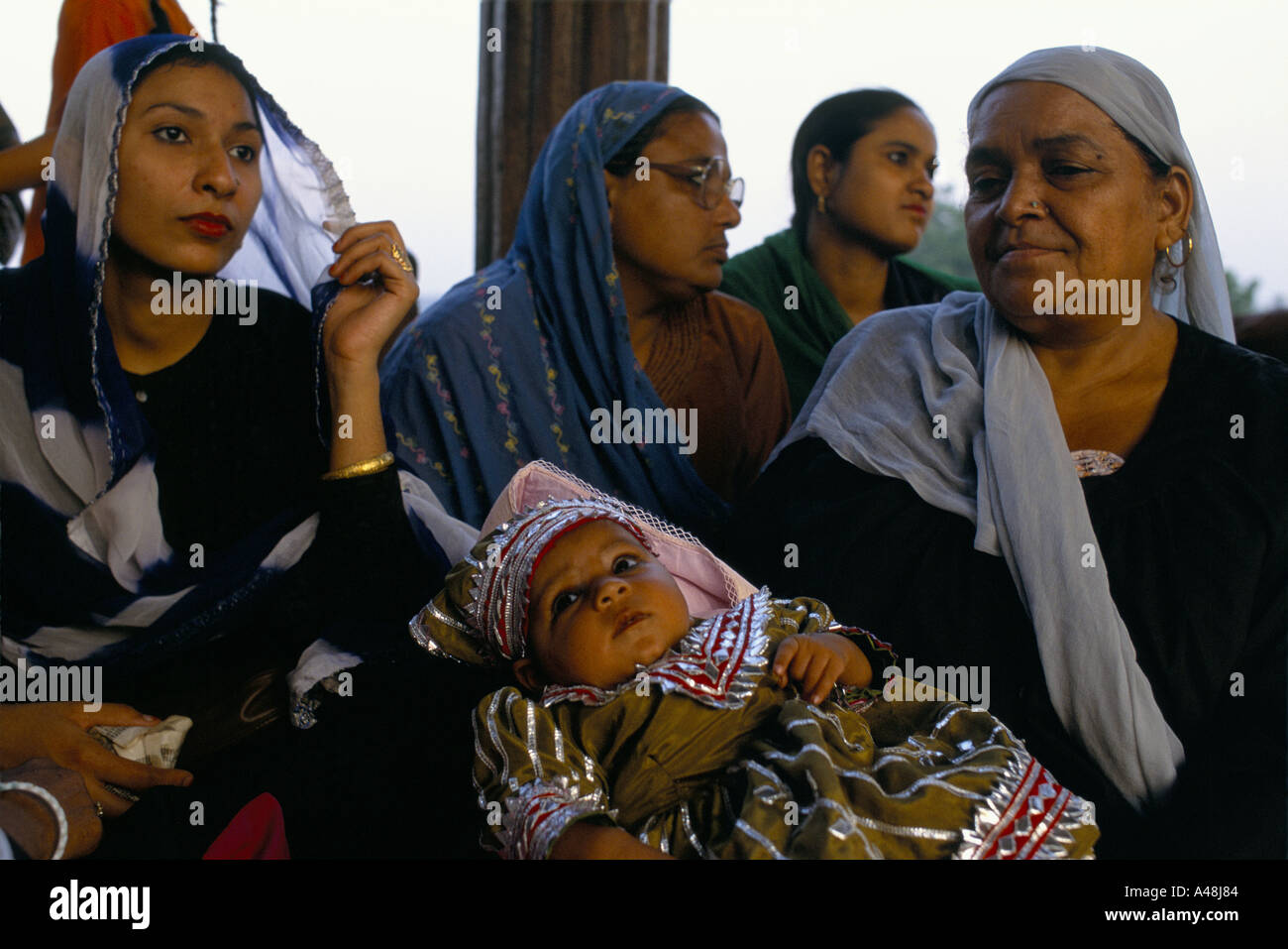 Baby naming ceremony hi-res stock photography and images - Alamy