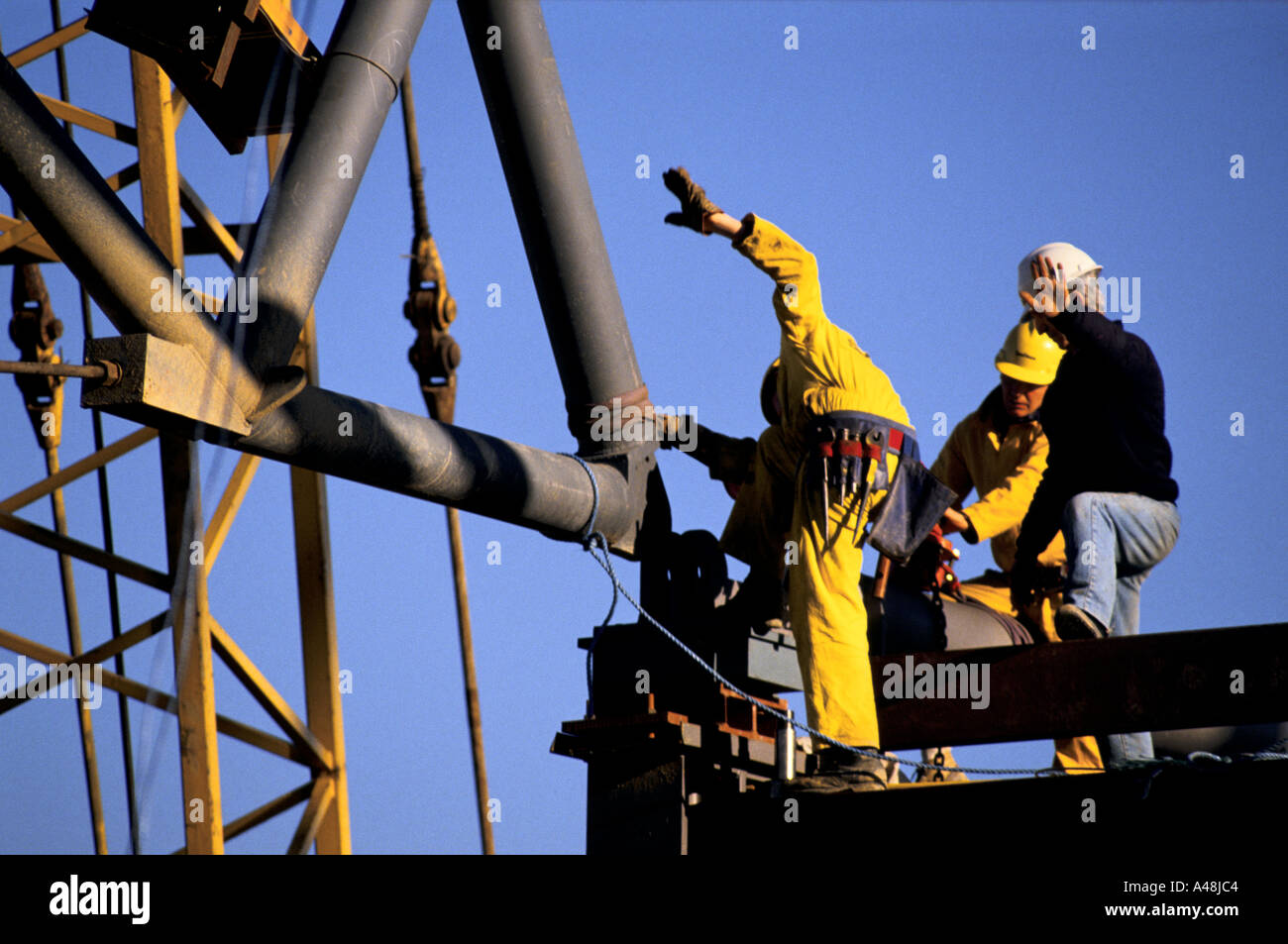 Men building a steel framed building near Luton England Stock Photo - Alamy