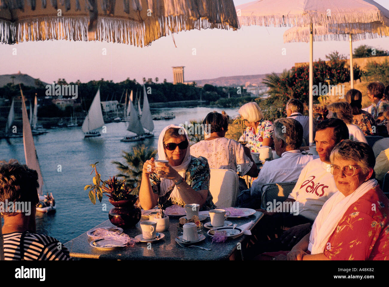 Tourist having afternoon tea on the terrace of The Old Cataracts Hotel ...