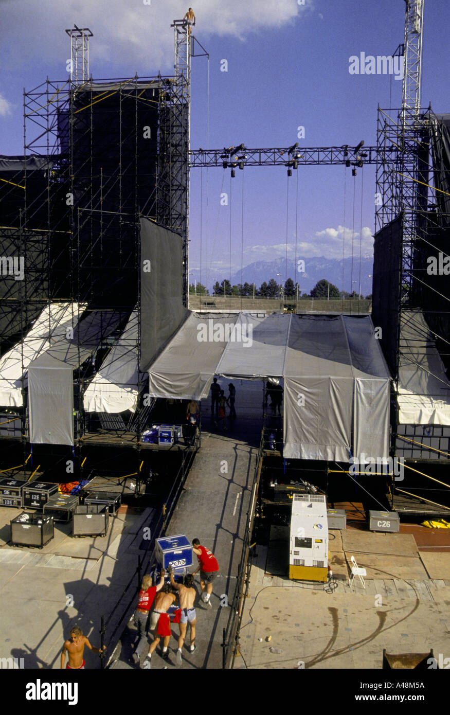 Roadies or technicians building the stage set for a concert by Irish ...