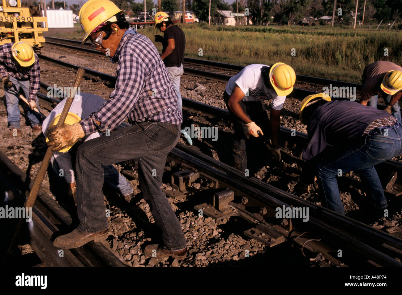 railway maintenance crew laying railway lines iowa usa Stock Photo - Alamy