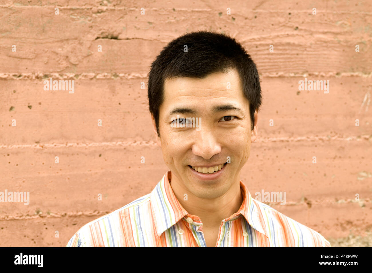 Mid adult man smiling, portrait Stock Photo - Alamy