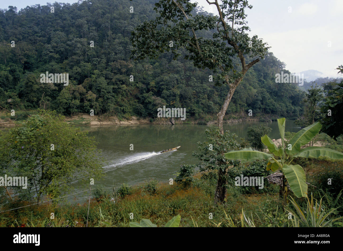 Karen soldiers on board a speed boat going down the moei river ...