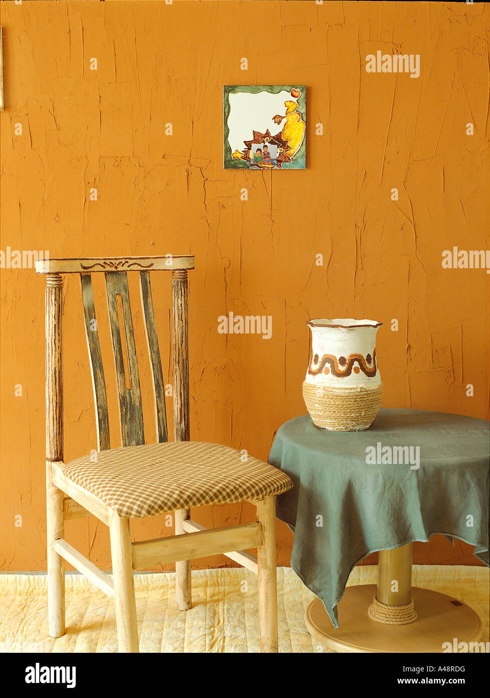 Empty chair with a table Stock Photo - Alamy