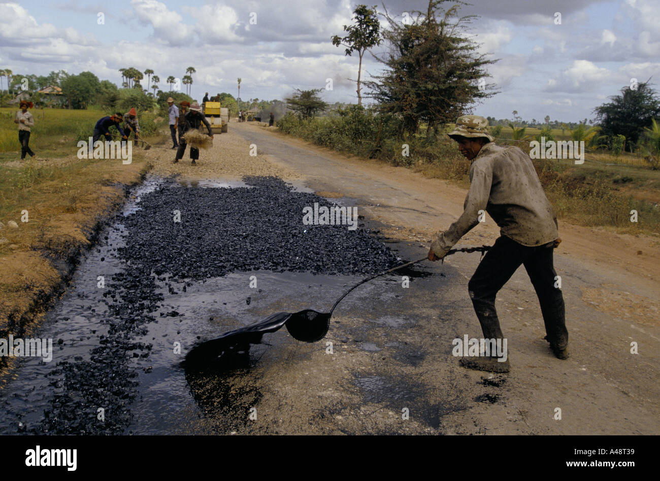 cambodia workers rebuilding roads which were destroyed by the khmer ...