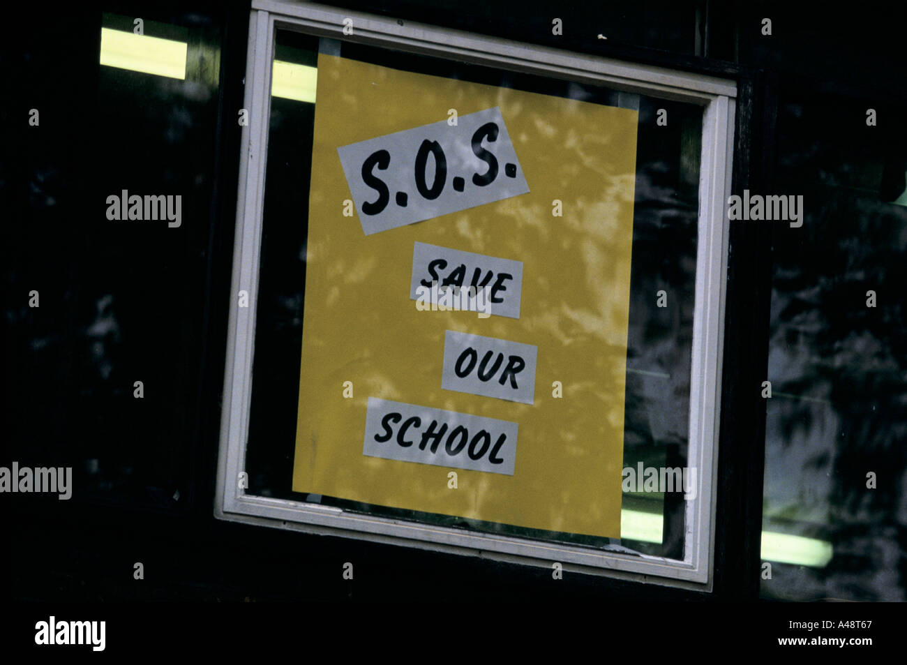 save our school poster up in classroom window Stock Photo - Alamy
