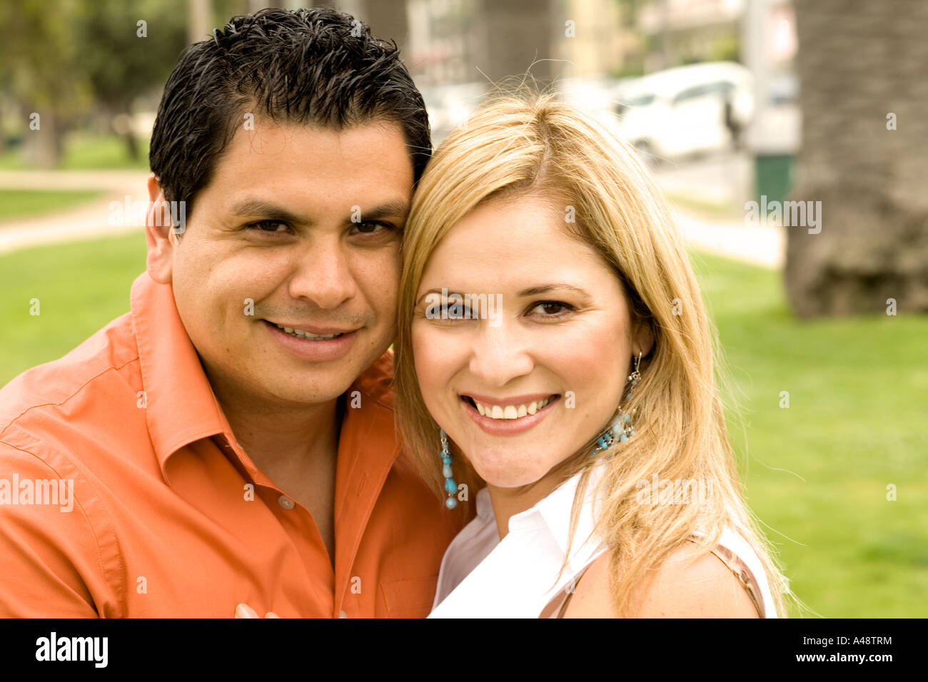 Mid adult couple embracing, smiling, portrait Stock Photo - Alamy