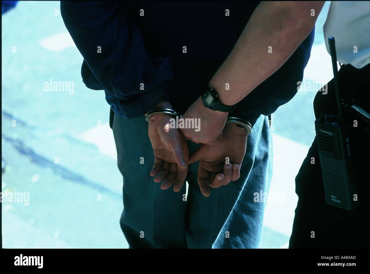 Thief arrested handcuffs hi-res stock photography and images - Alamy