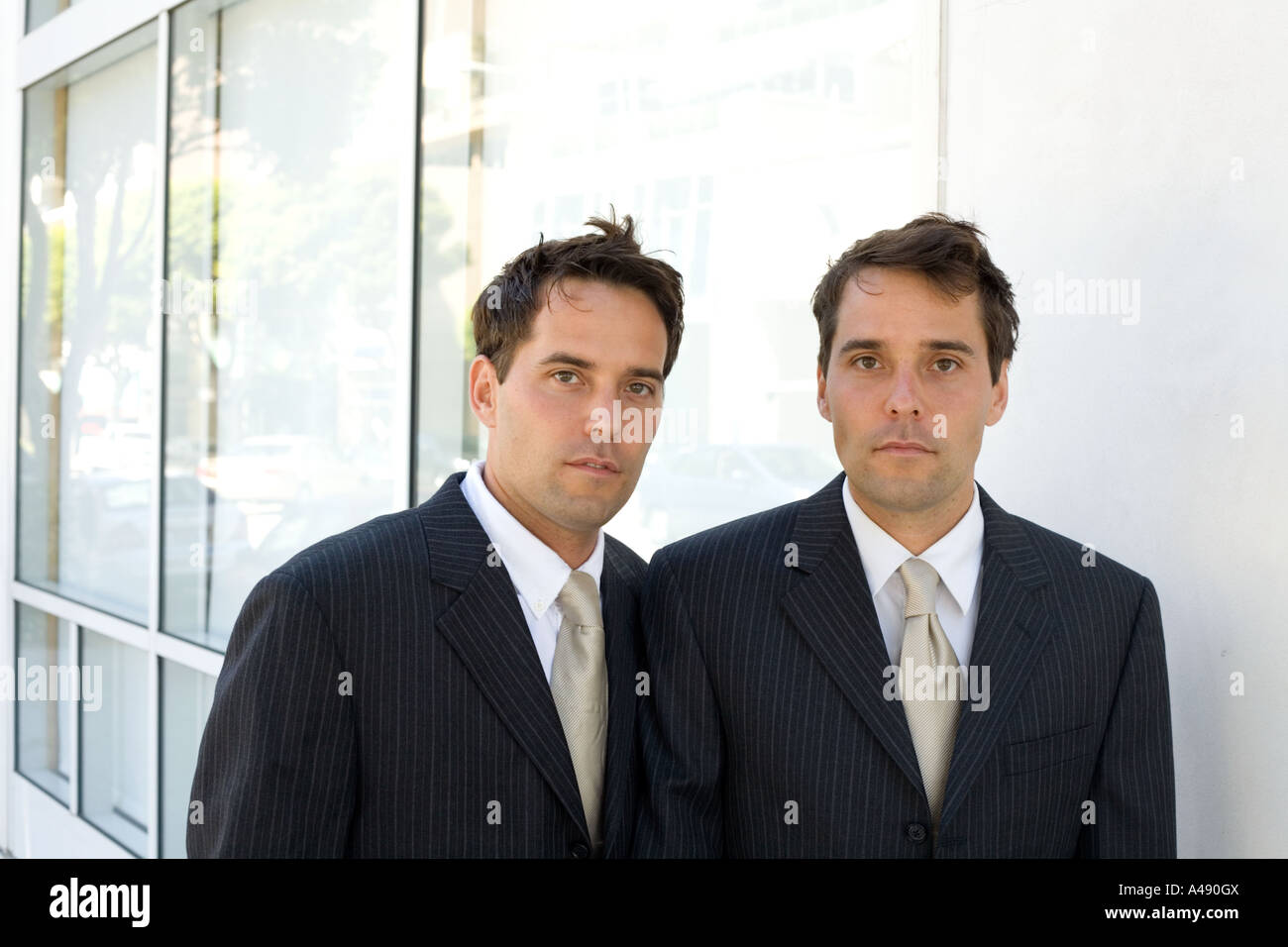 Young businessmen staring, portrait Stock Photo - Alamy