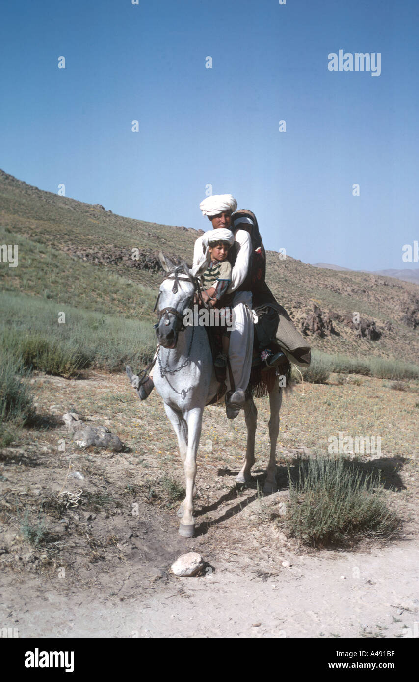 Aimaq family on a horse near the Minaret of Jam Afghanistan Stock Photo ...