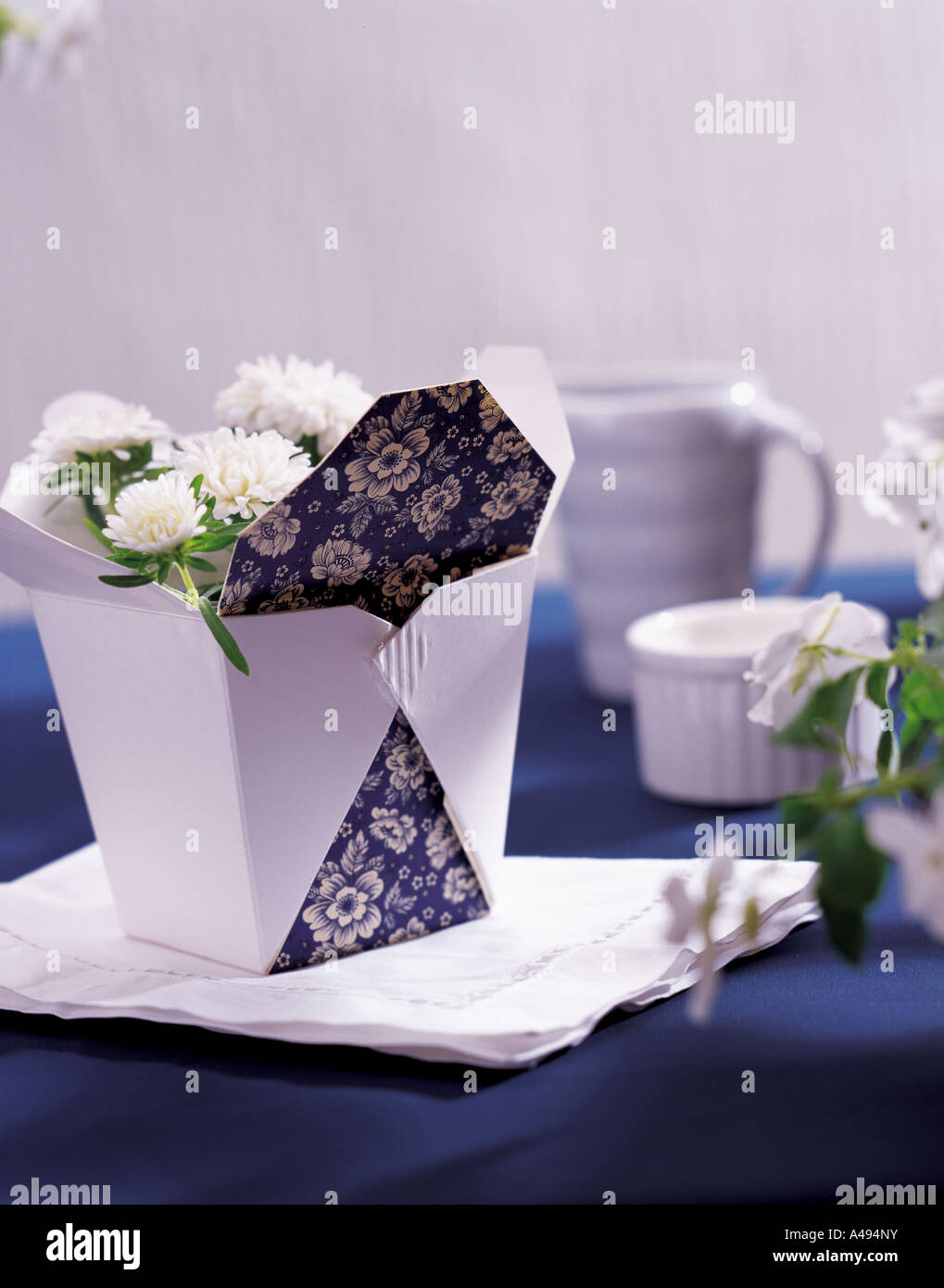 Bunch of flowers in a paper bag on the table Stock Photo - Alamy