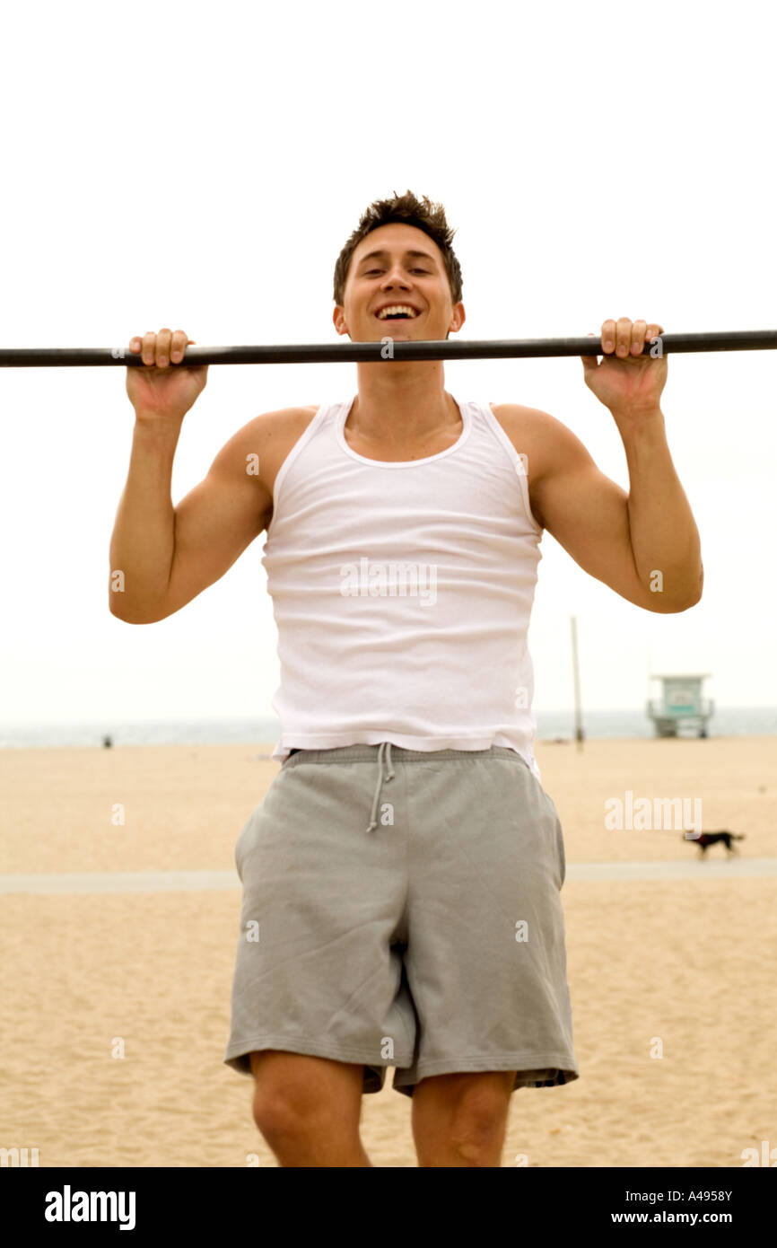 Young man performing exercise, portrait Stock Photo - Alamy