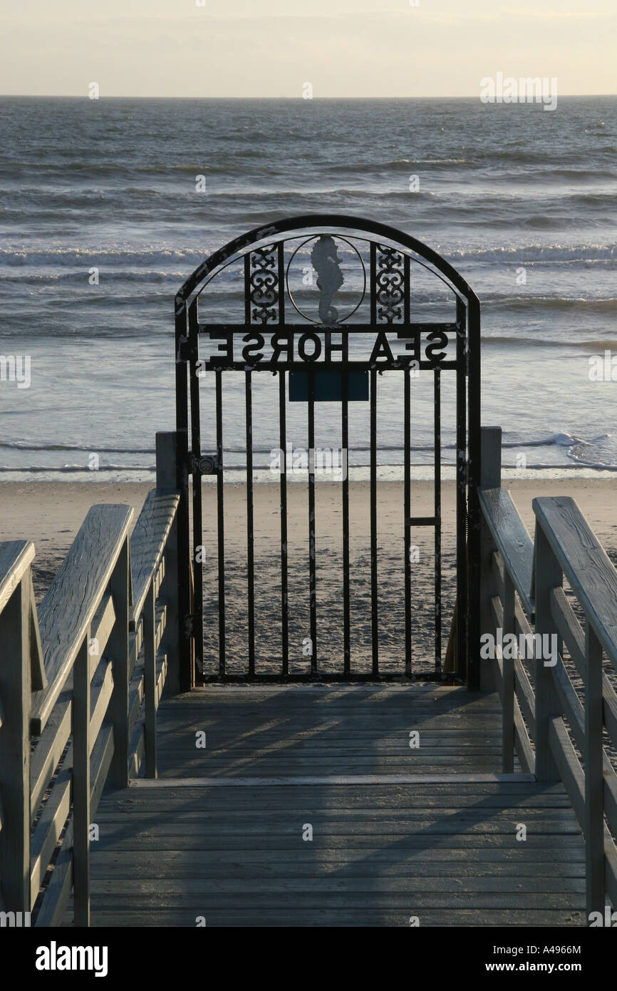Beach gate at end of walkway Stock Photo - Alamy
