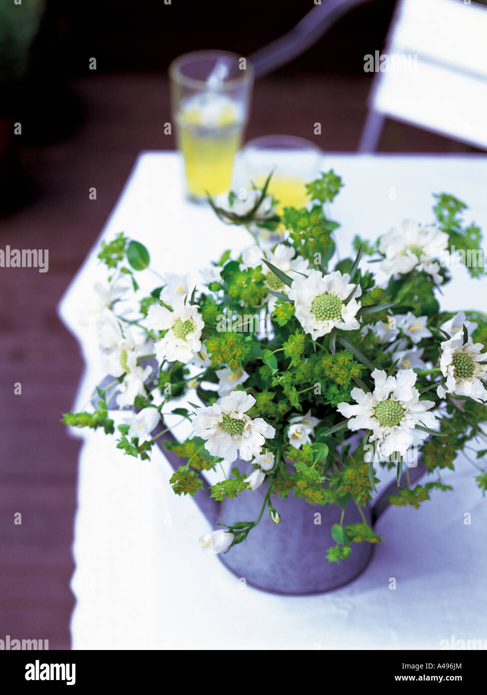 High angle view of flowers in a kettle on the table Stock Photo - Alamy