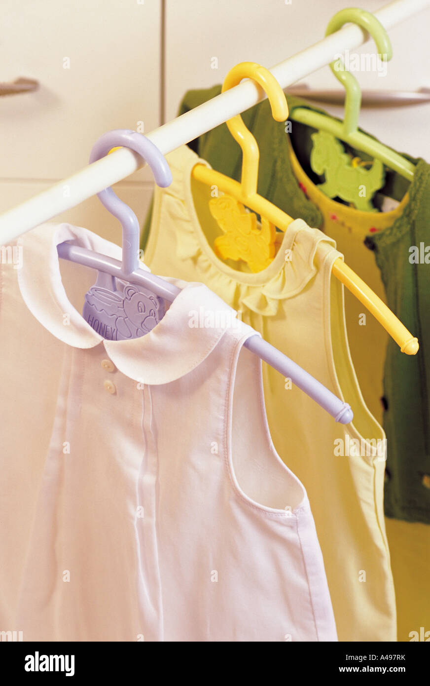 High angle view of dresses hanging on a clothes rack Stock Photo - Alamy