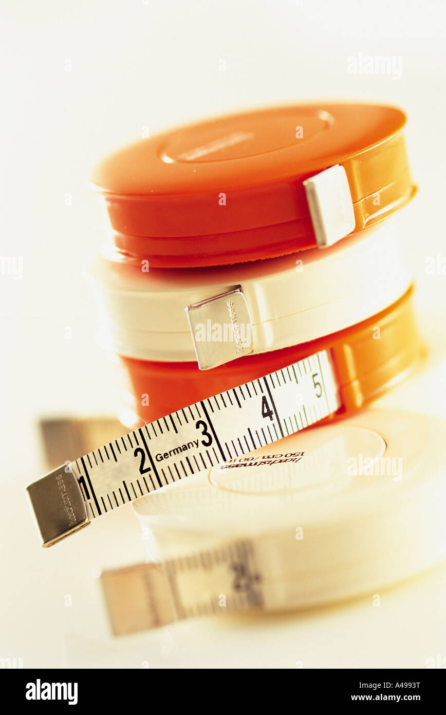 Close-up of a stack of measuring tapes Stock Photo - Alamy