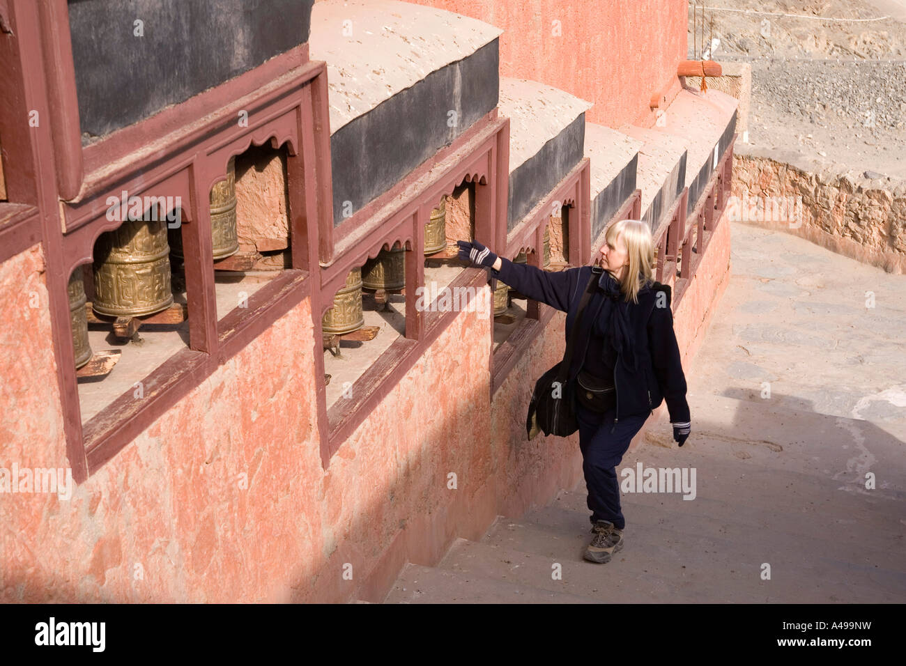 India Ladakh Leh Valley Tikse Gompa western tourist turning prayer ...