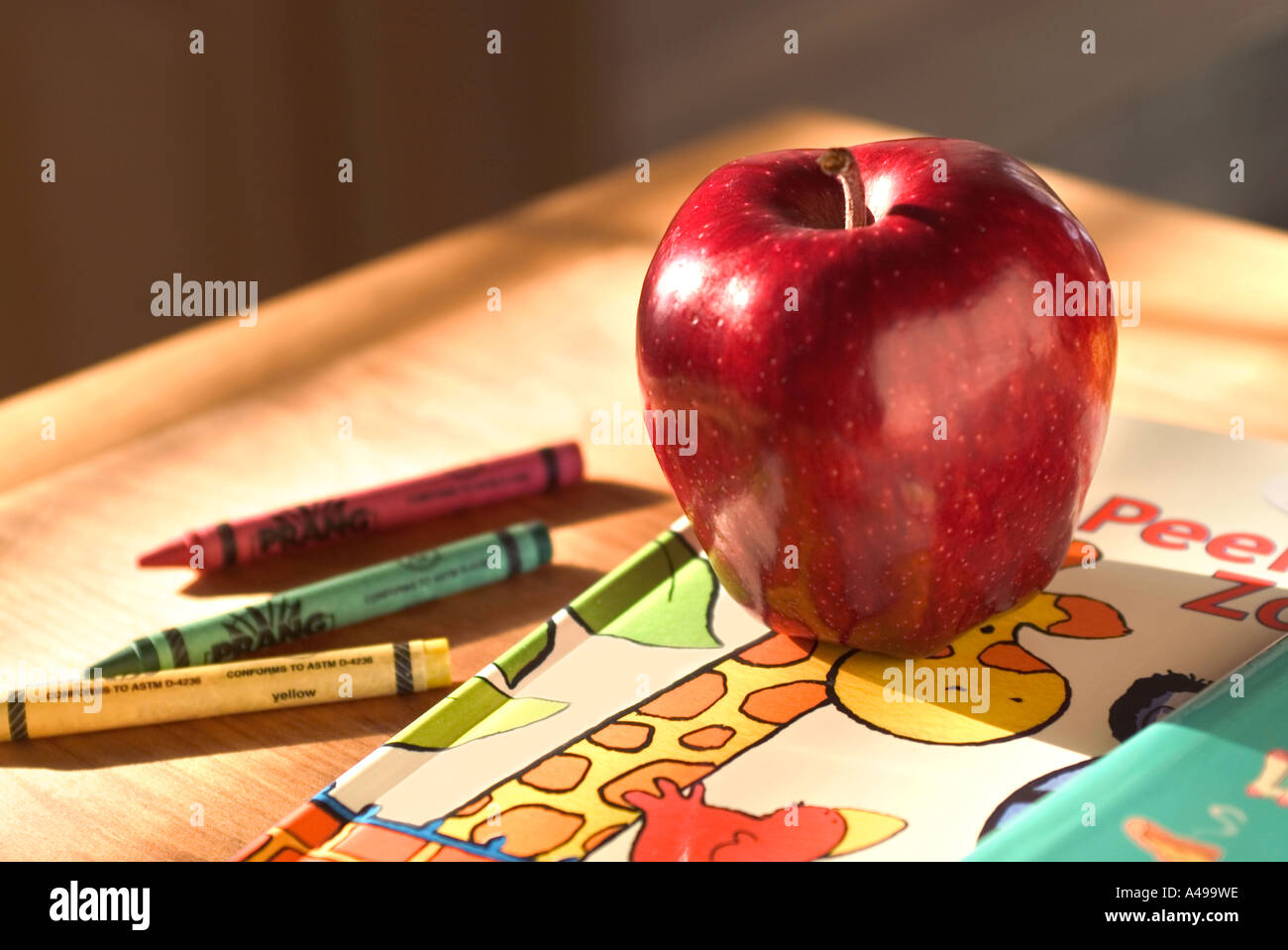 An apple for teacher on student desk in elementary school Stock Photo ...
