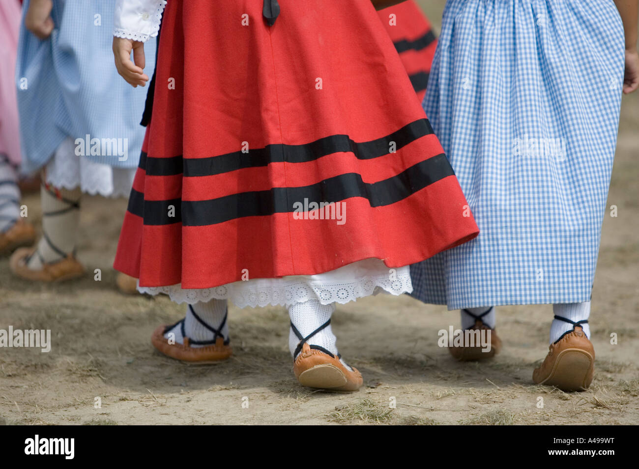 Traditional dresses worn by female Basque folk dancers during fiesta ...