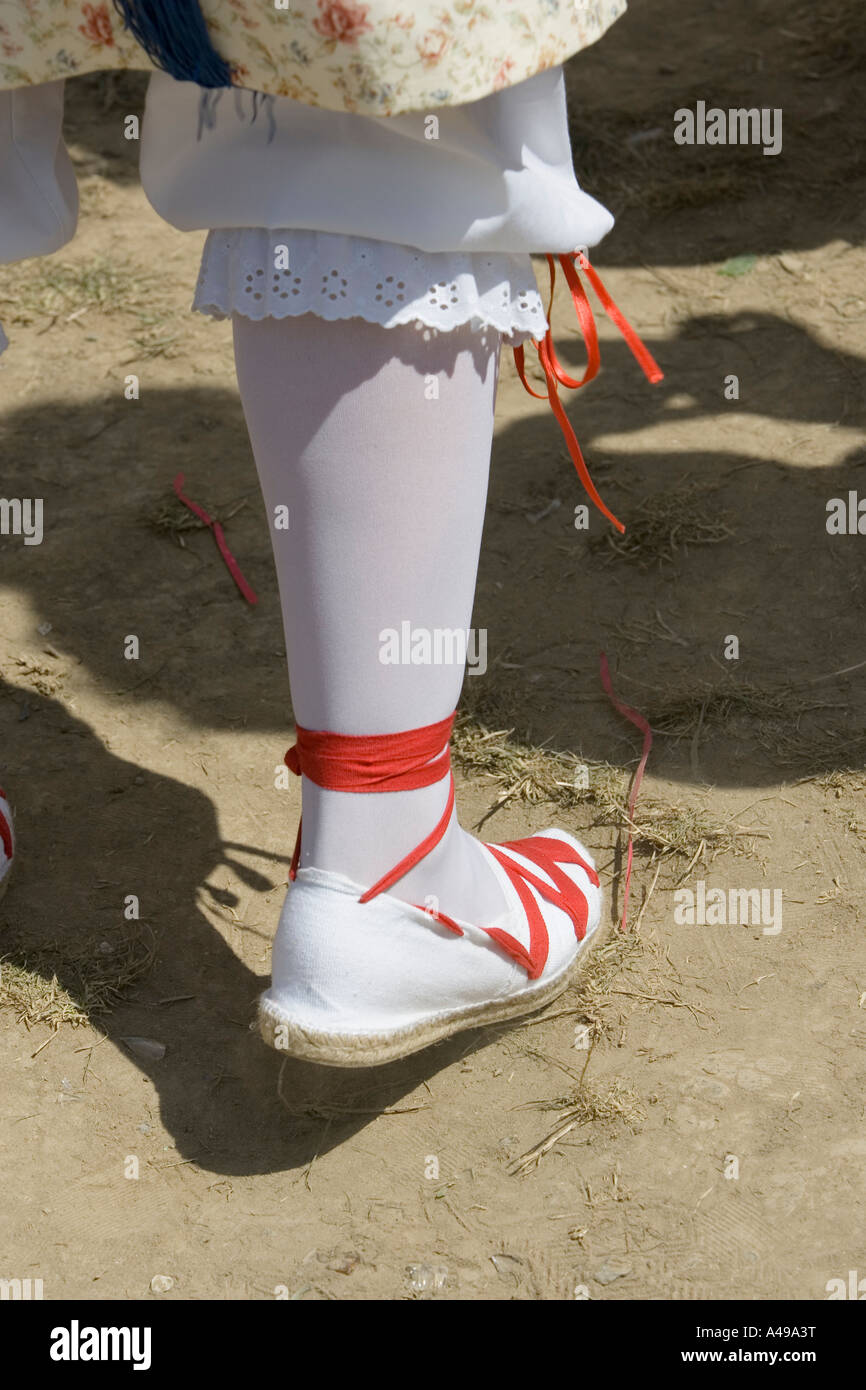 Close up of leg of red ribbons worn by Basque woman performing Basque ...